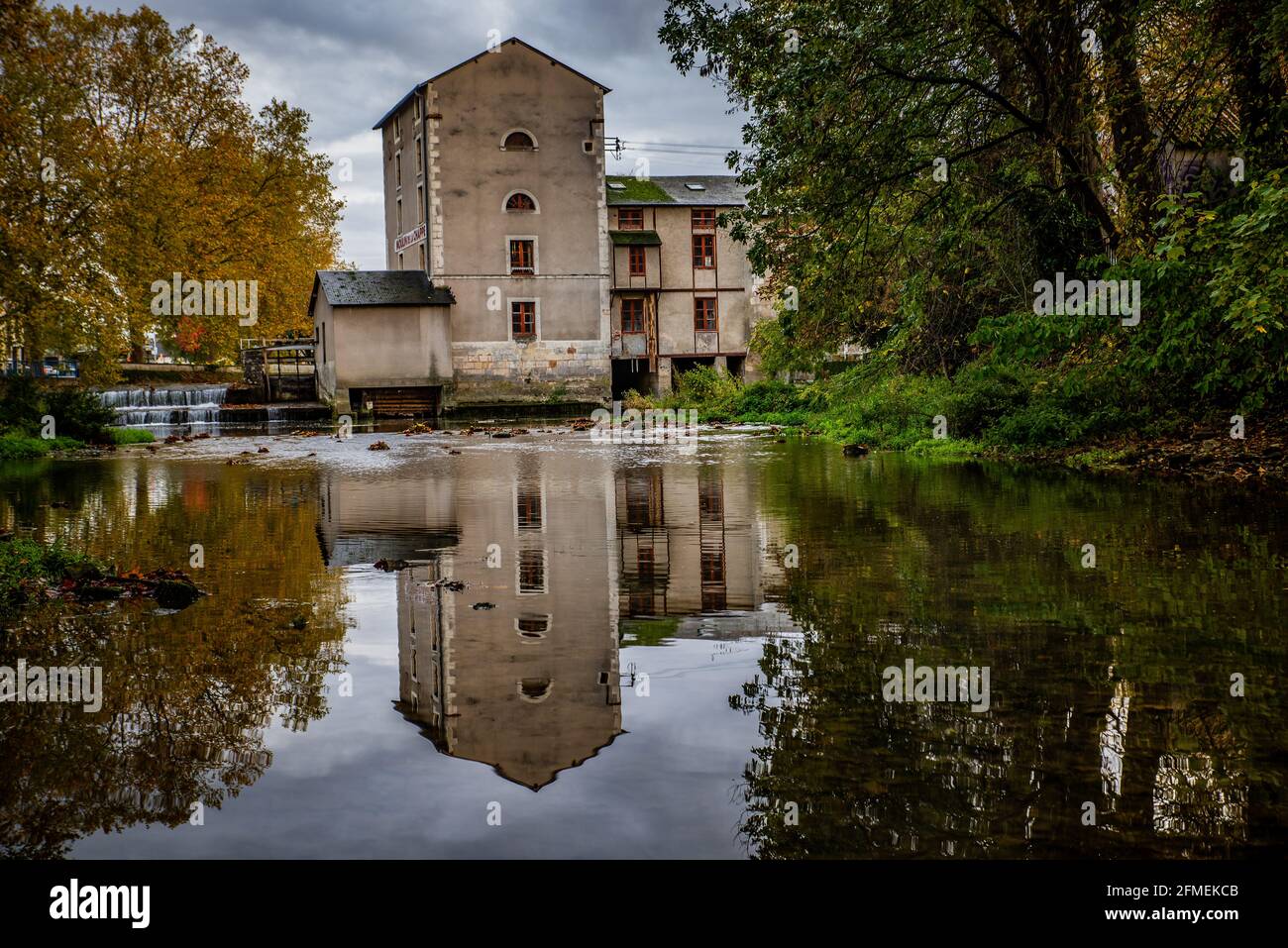 the old mill and its reflection in the river Stock Photo - Alamy