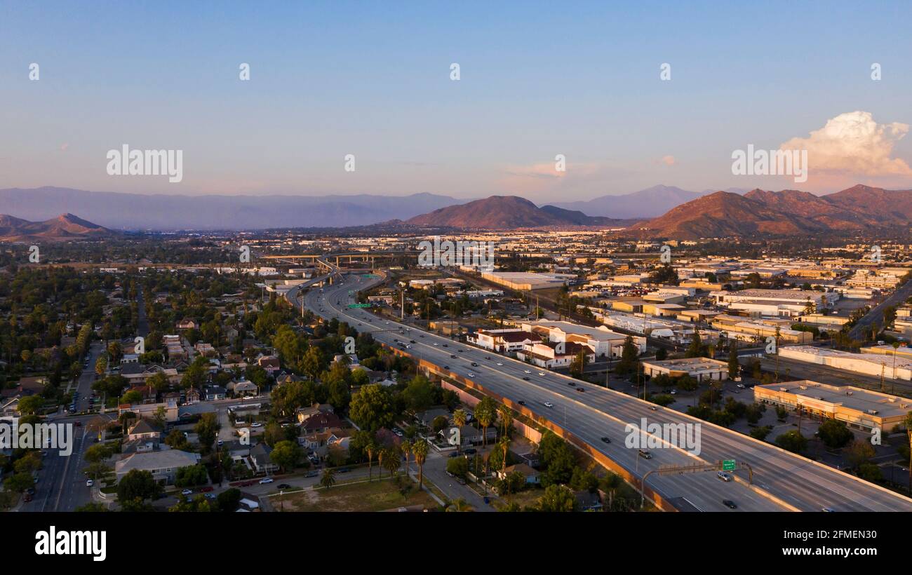 Aerial sunset view of the residential and industrial areas of Riverside ...