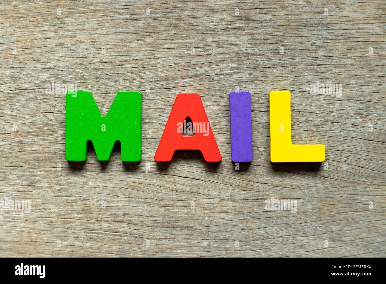 Color alphabet letter in word mail on wood background Stock Photo - Alamy