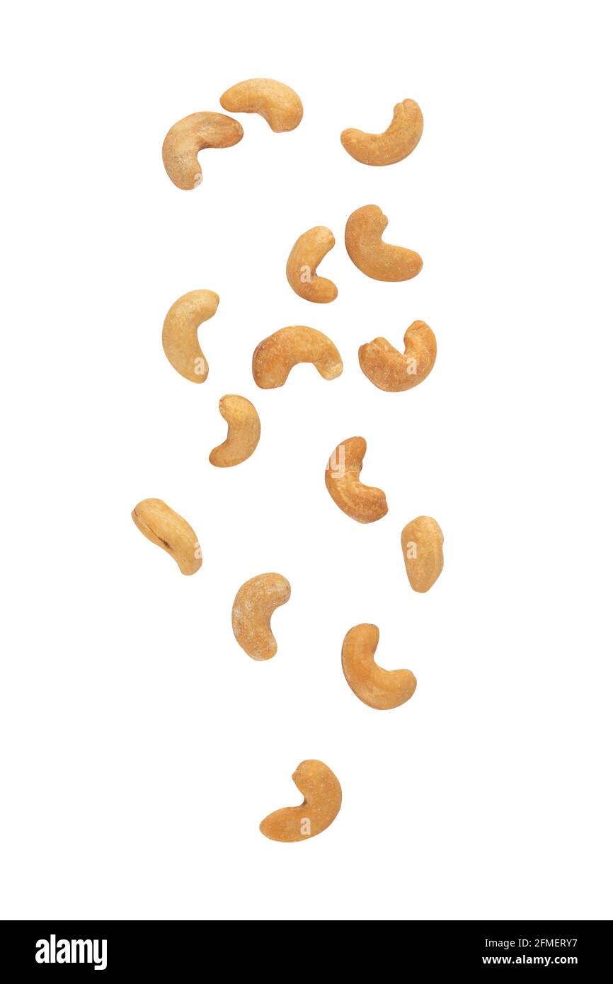 Cashew nuts falling isolated on white background with clipping path ...