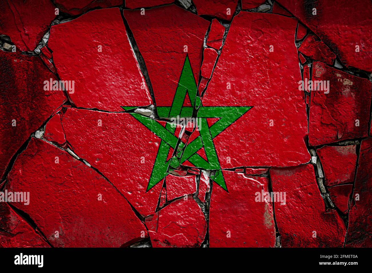 National flag of Morocco depicting in paint colors on an old stone wall ...