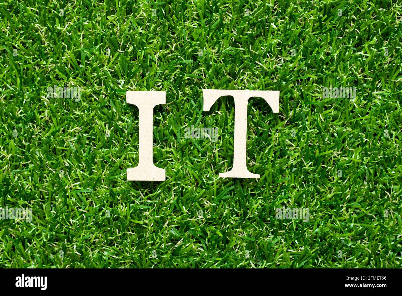 Wood alphabet letter in word IT (Abbreviation of information technology ...