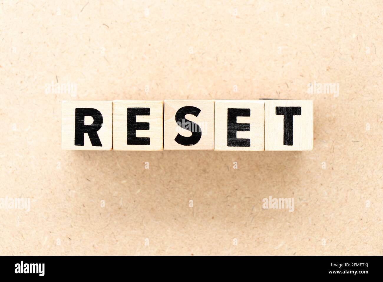 Alphabet letter block in word reset on wood background Stock Photo - Alamy