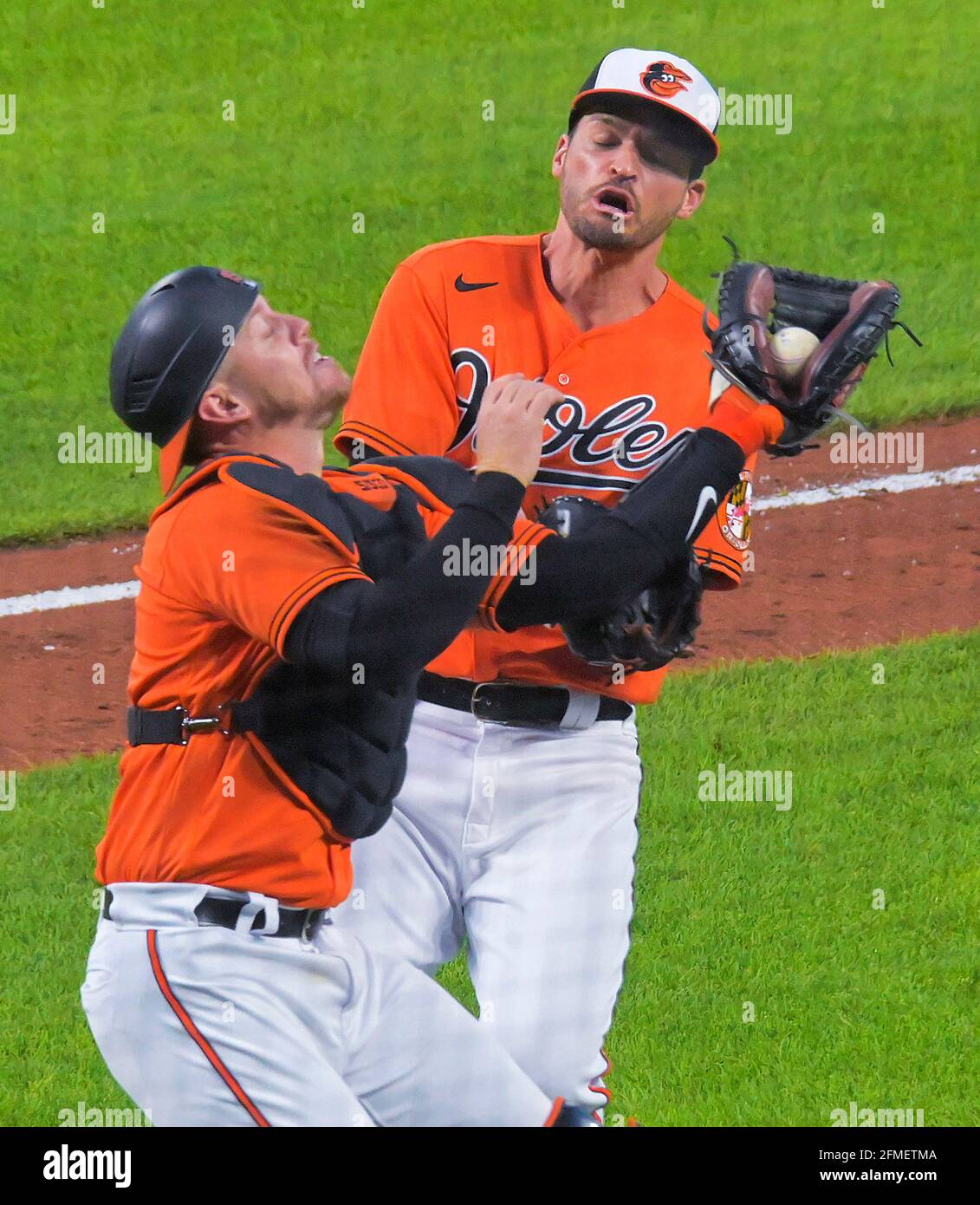 Baltimore Orioles first baseman Trey Mancini, top, collides with ...