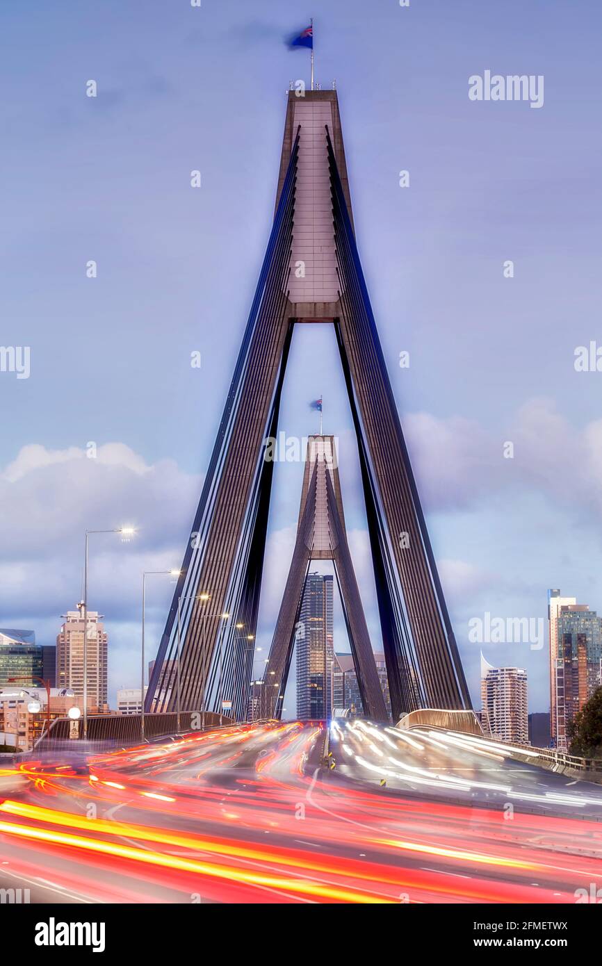 Cable arches of Anzac bridge in the City of Sydney at sunset with ...