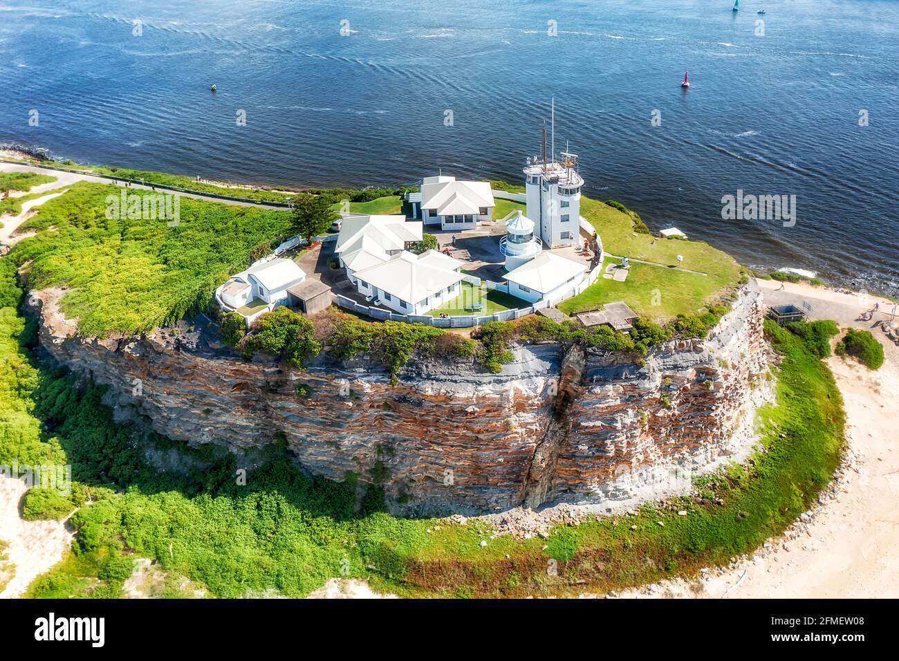 Nobbys head lighthouse in Newcastle city at the delta of Hunter River ...