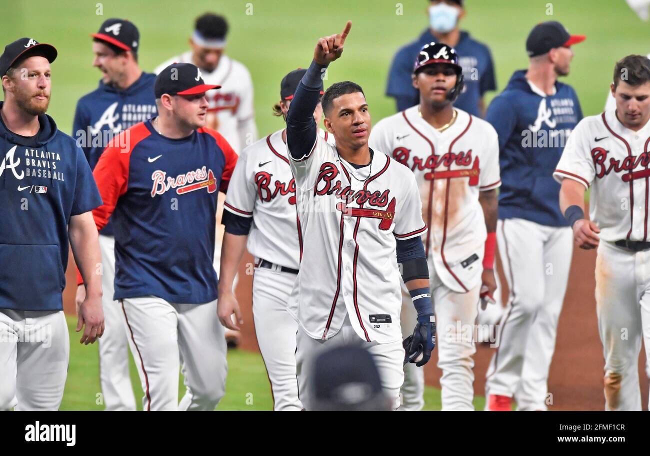 May 08, 2021: Atlanta Braves outfielder Ehire Adrianza (center) points to the crowd while ...