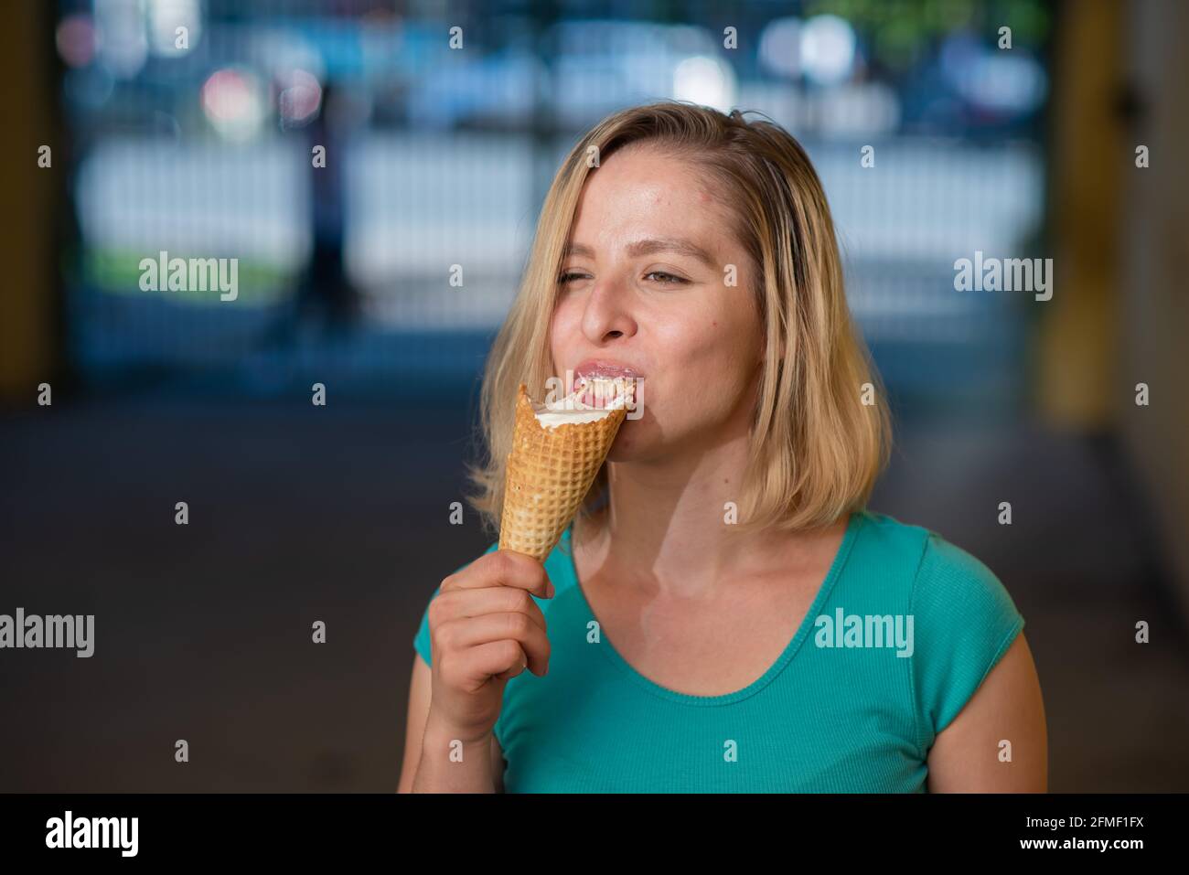 Girl walking eating ice cream on hi-res stock photography and images ...