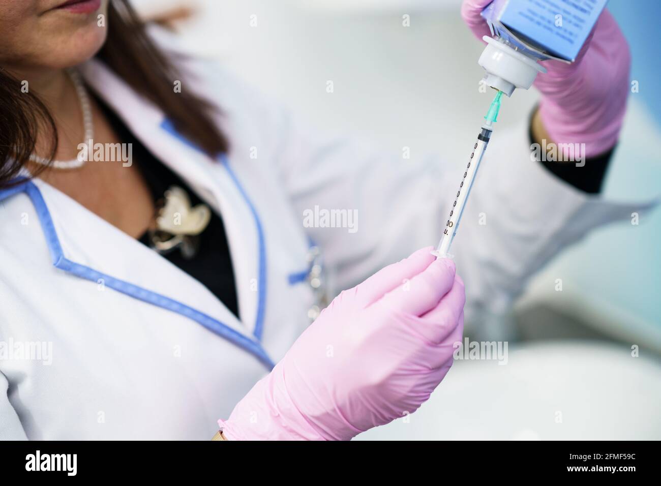 Aesthetic doctor preparing the syringe with the botox Stock Photo - Alamy