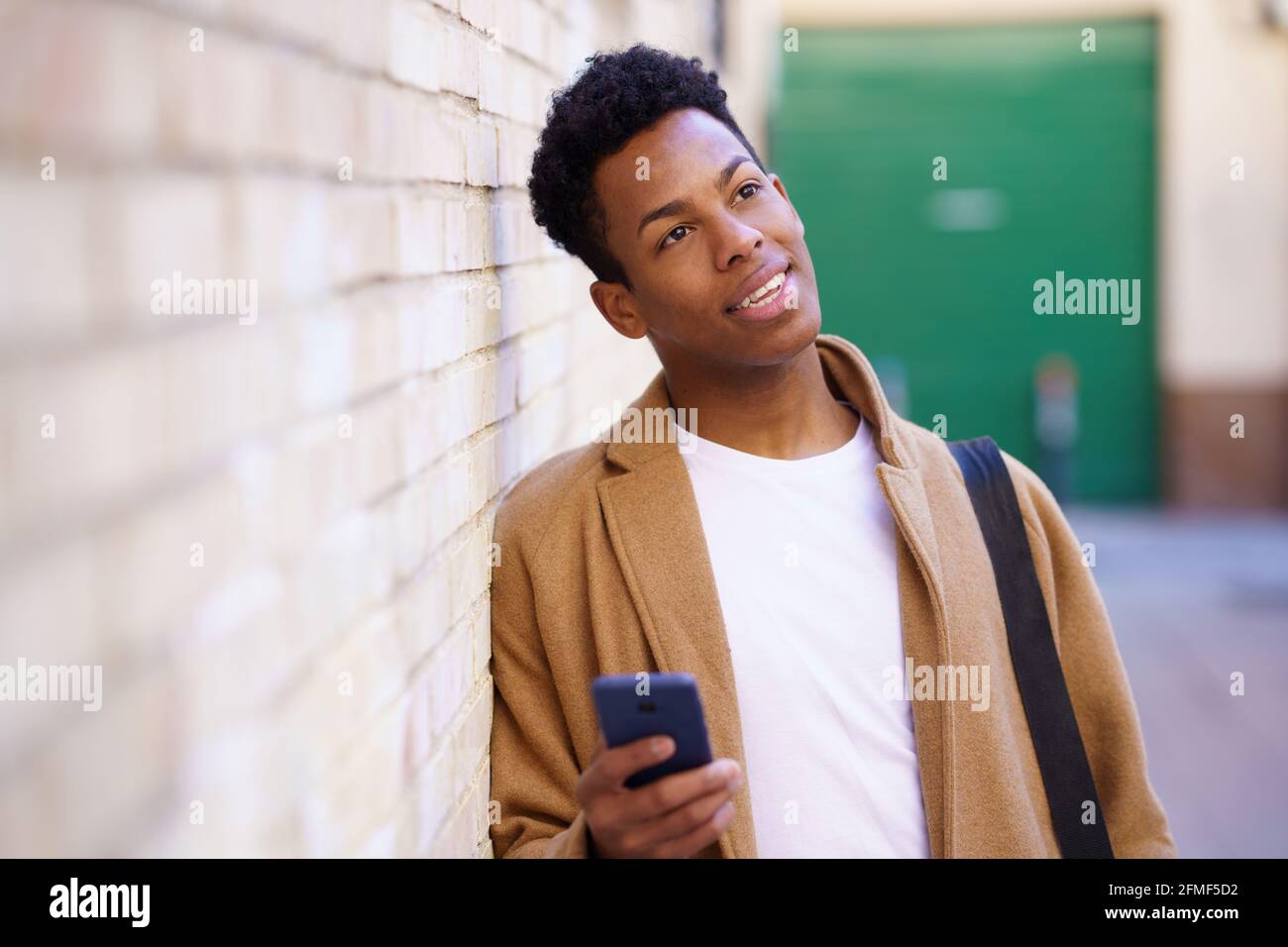 Young Cuban man with a happy hopeful look on his face Stock Photo - Alamy