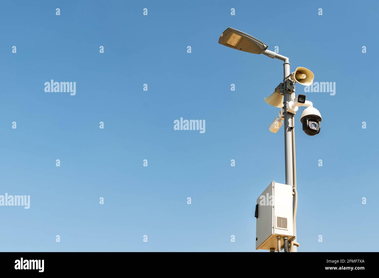 A cluster of security cameras on a lamppost, in a public Park on the ...