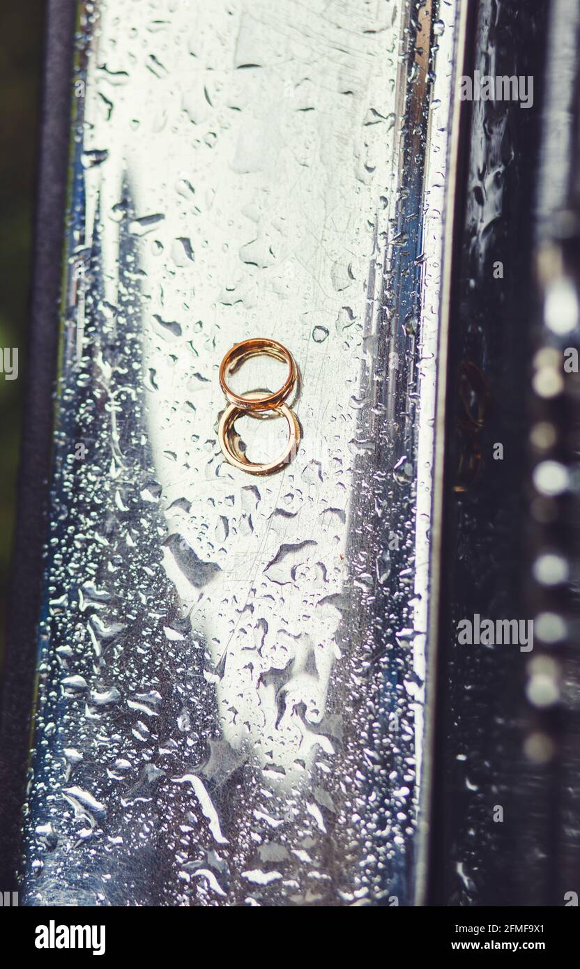 Beautiful silver background with wedding rings and drops Stock Photo ...