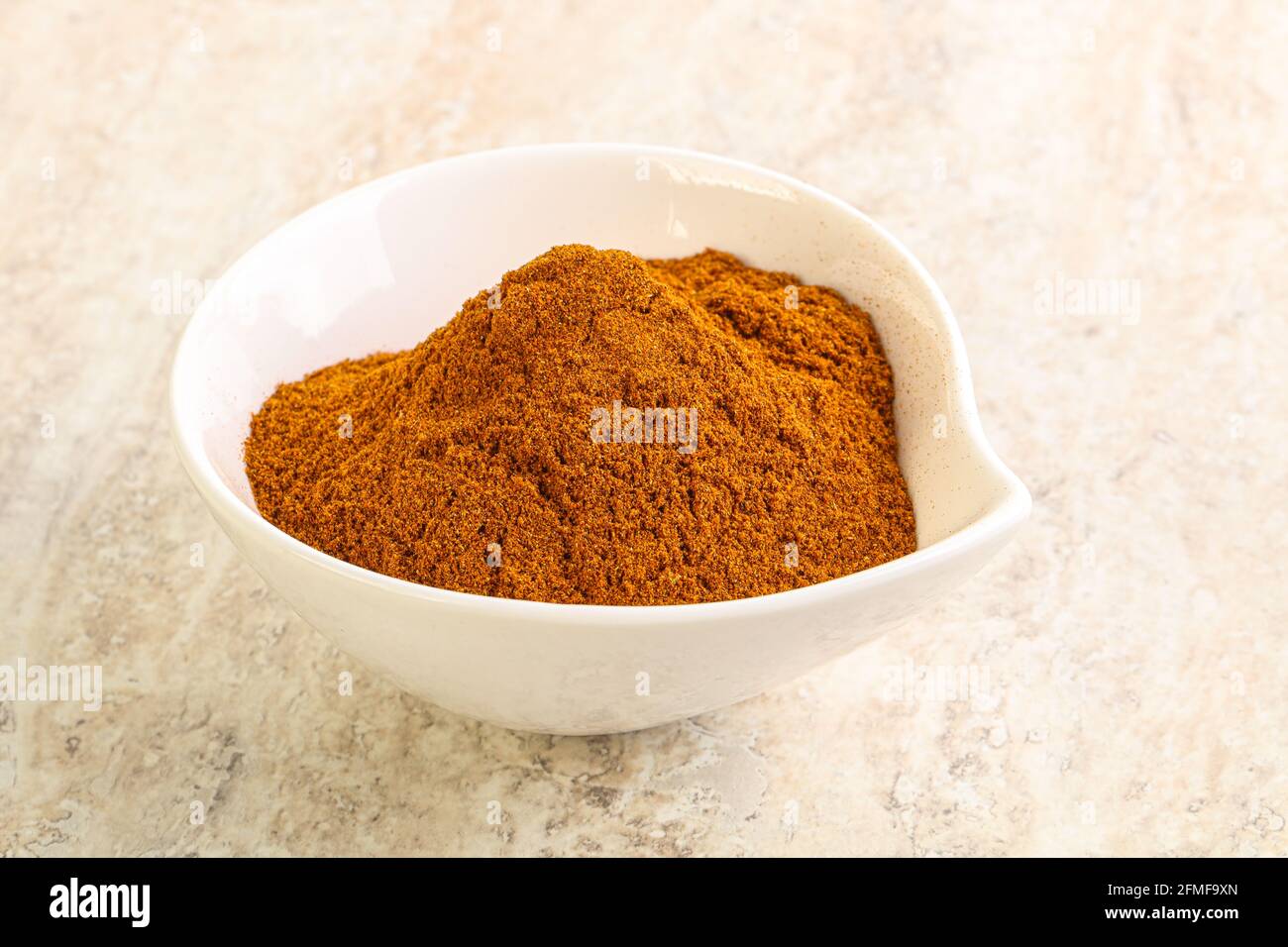 Dry Paprika powder in the bowl isolated Stock Photo - Alamy