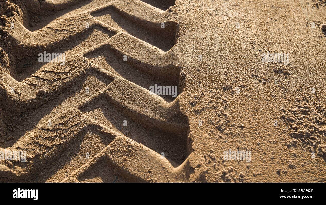sand with tractor wheel tread on it for your creativity or desktop ...