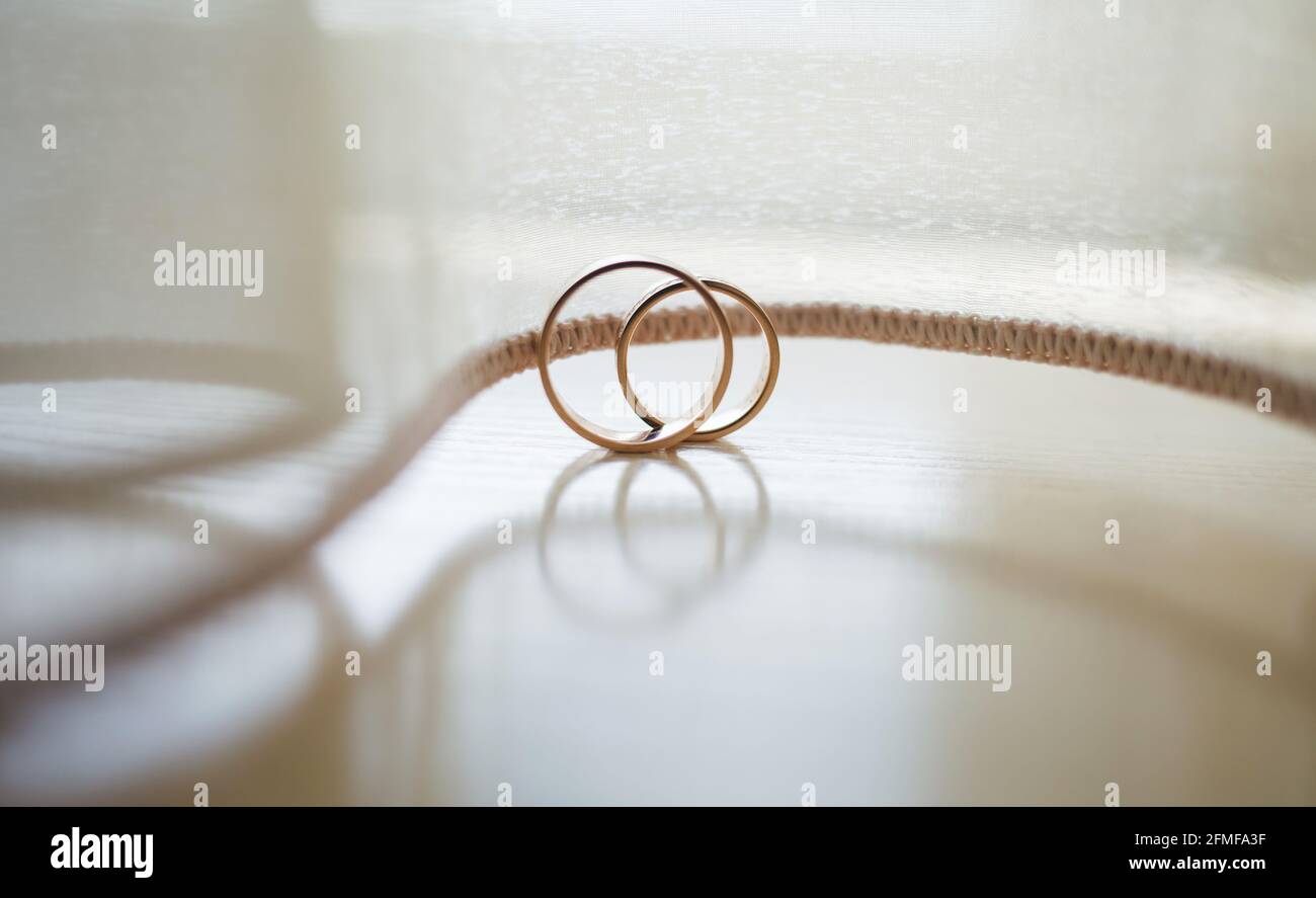 Wedding rings on background Stock Photo - Alamy