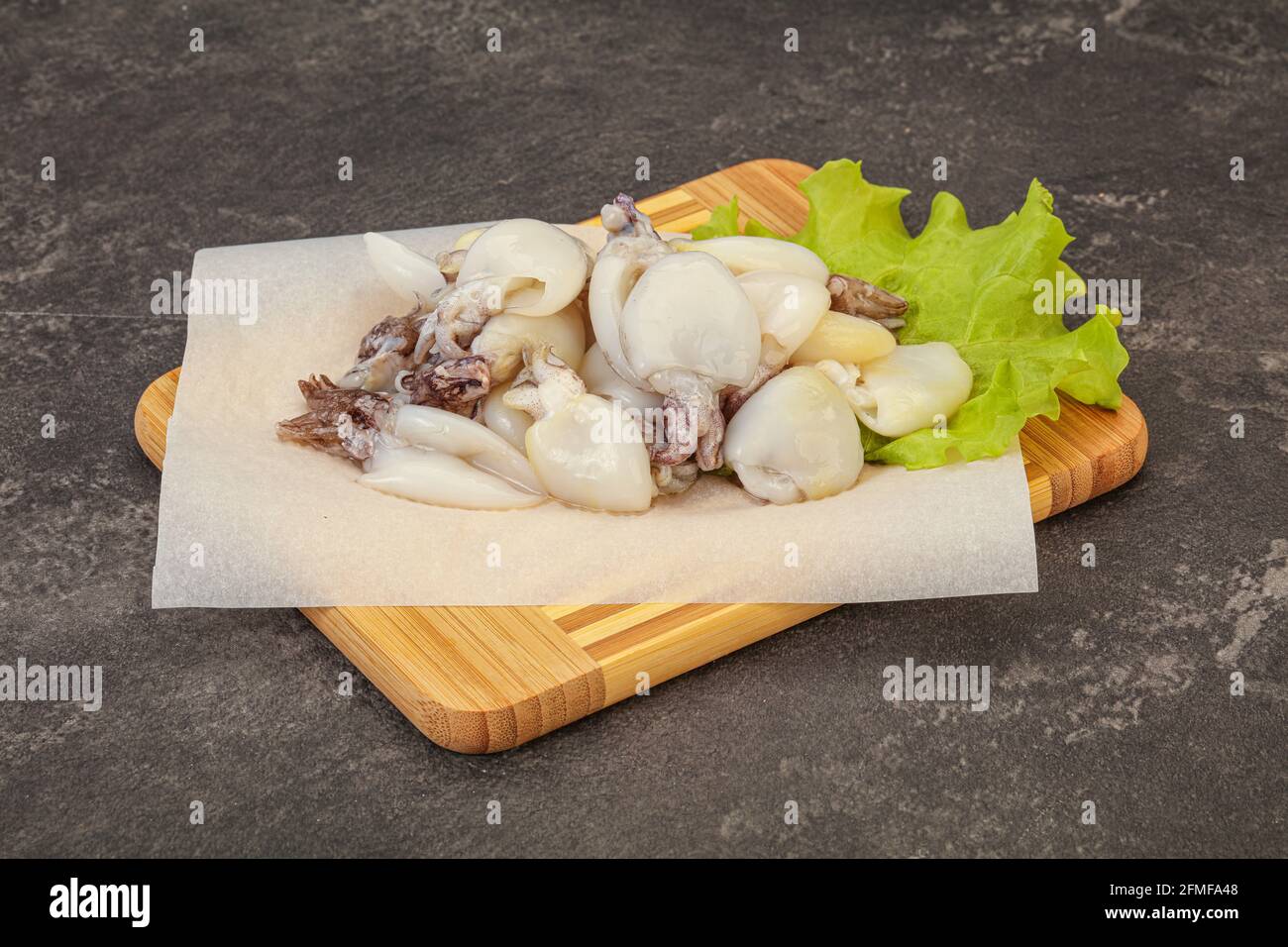 Raw seafood - cuttlefish for cooking over board Stock Photo - Alamy
