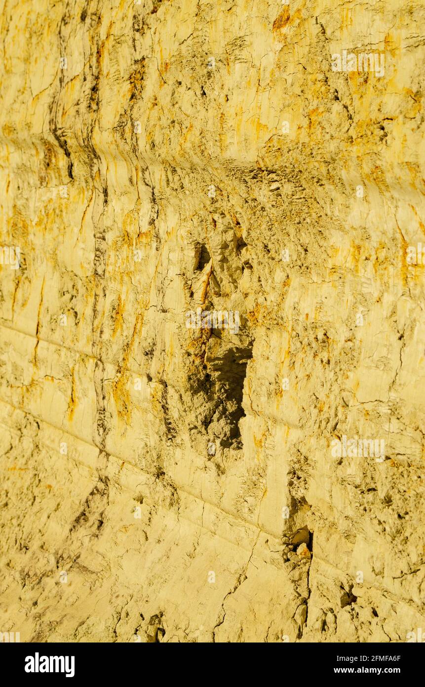Natural background - vertical wall of clay. soil texture the cliff ...