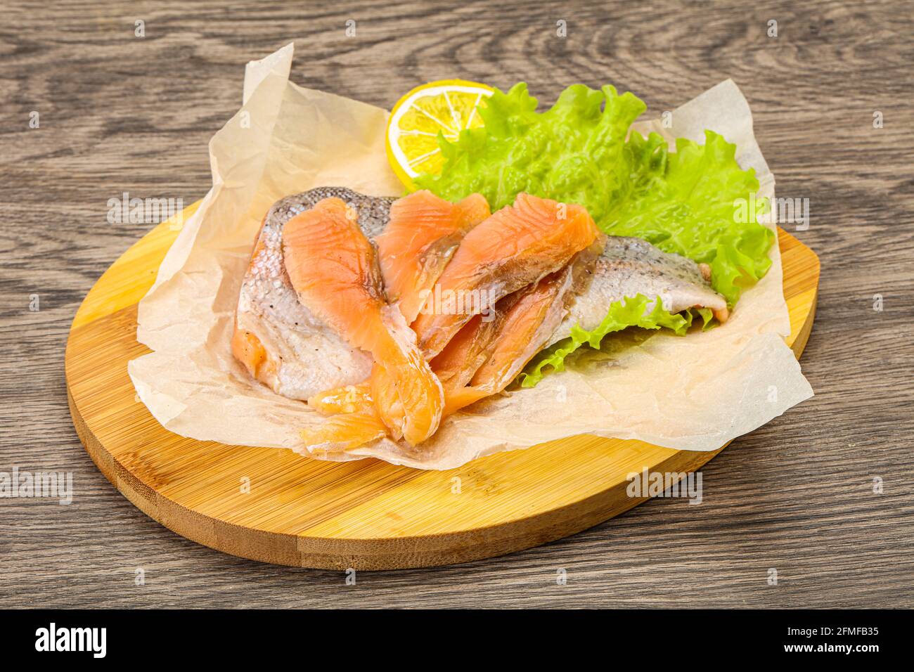 Sliced natural wild trout fillet over board Stock Photo - Alamy