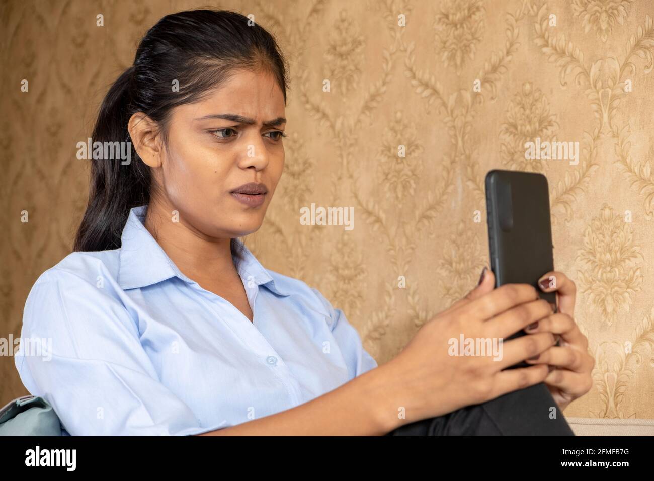An Indian female doing video call Stock Photo - Alamy