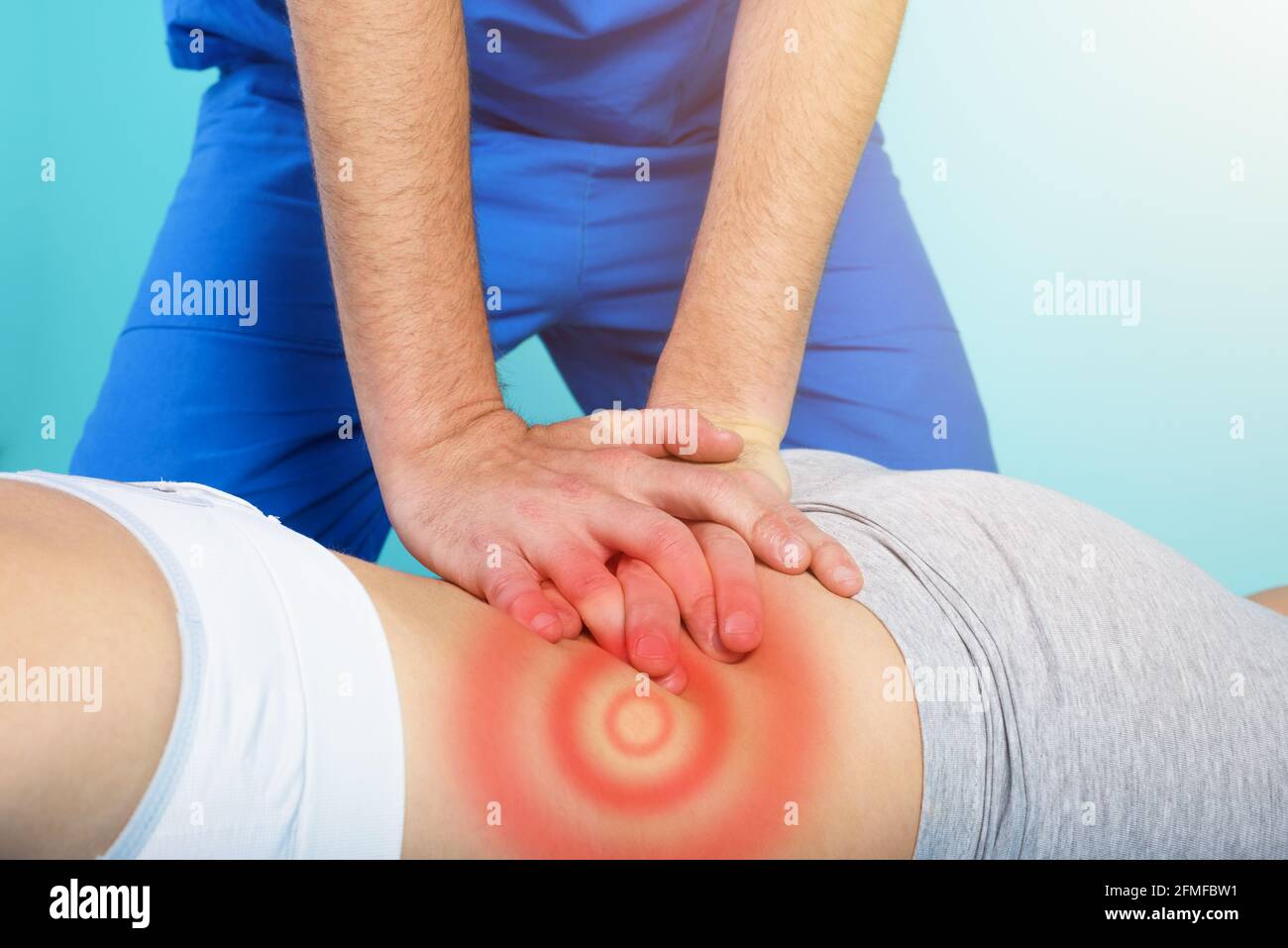 Girl performs exercises with a physiotherapist. Cyan background Stock ...