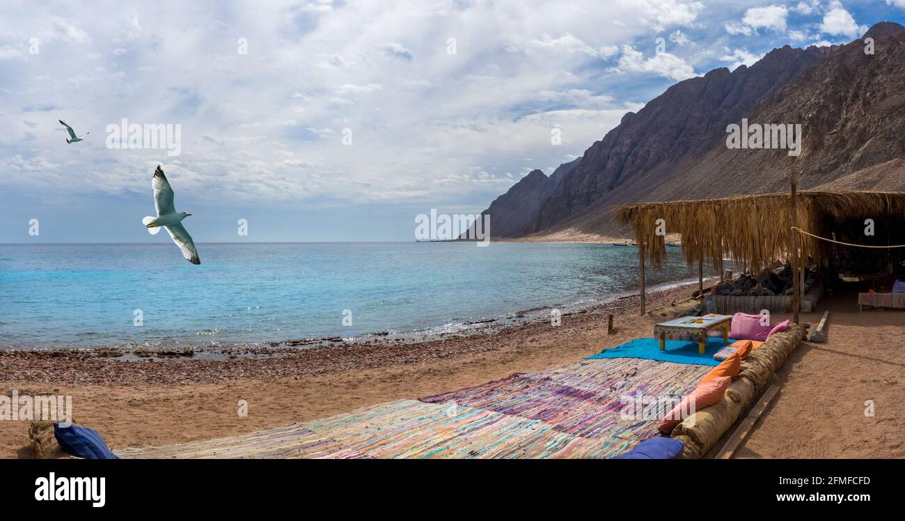 Egyptian coast of the Red Sea, blue bay in Dahab resort Stock Photo - Alamy