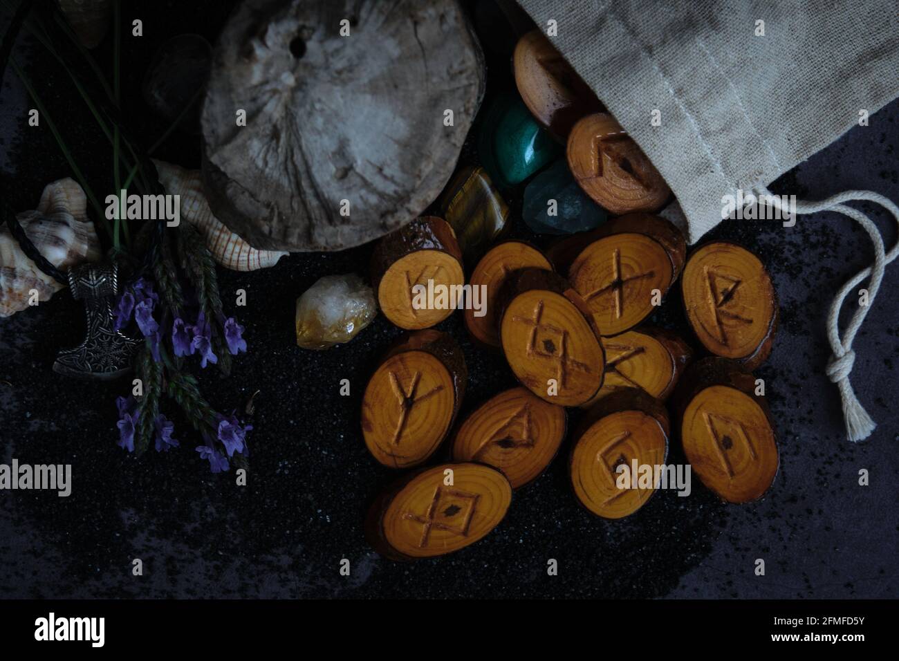 homemade wooden runes on a dark background Stock Photo - Alamy