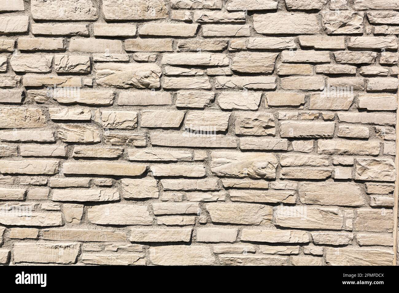 Off white brick stone wall, different size bricks, textured Stock Photo ...