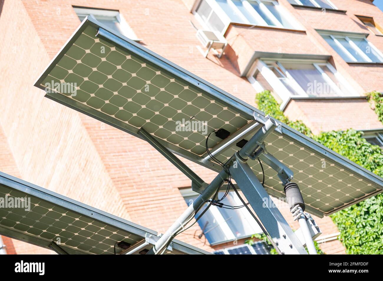 Solar panels on the background of a brick house Stock Photo - Alamy