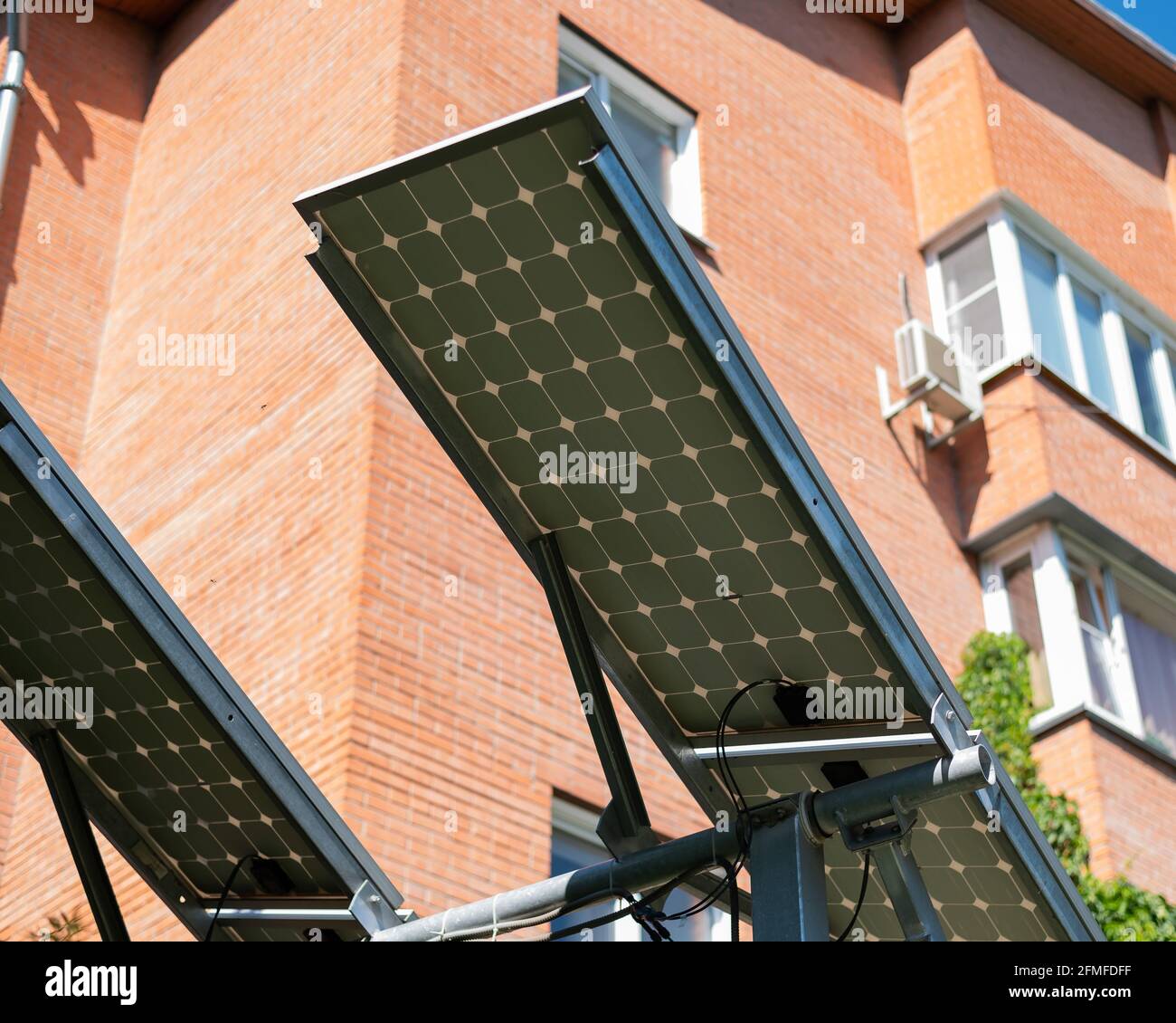 Solar panels on the background of a brick house Stock Photo - Alamy