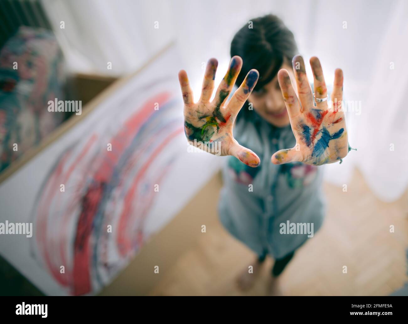 Colours on painter hand. Shallow depth of field on artist hands. Female ...