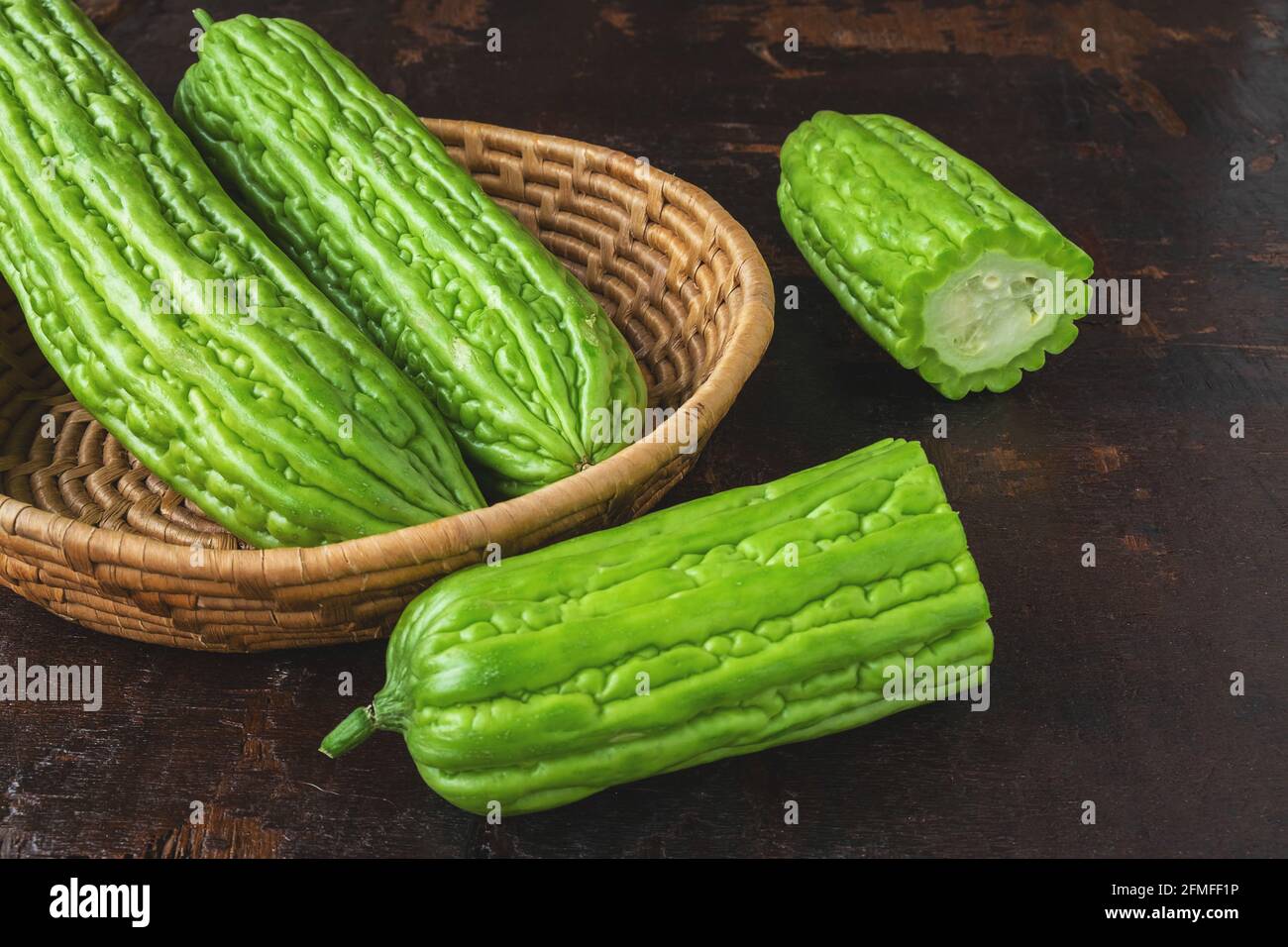 Fresh bitter gourd in a basket Stock Photo - Alamy