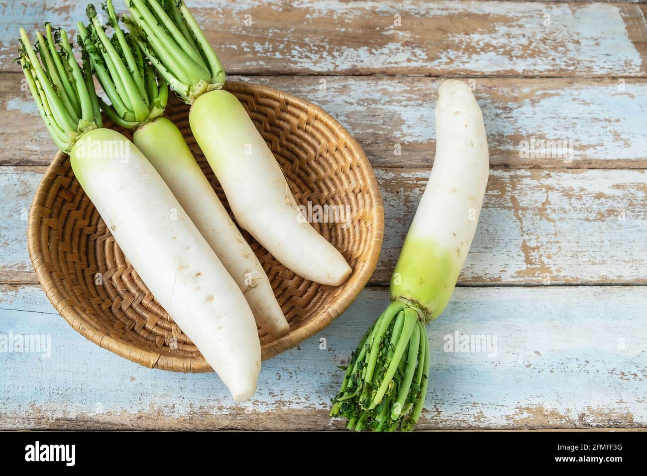 Fresh radish in a wooden basket Stock Photo - Alamy