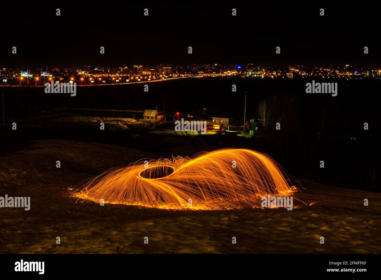 Large round burning fireworks sparkle from the burning steel wool. The ...