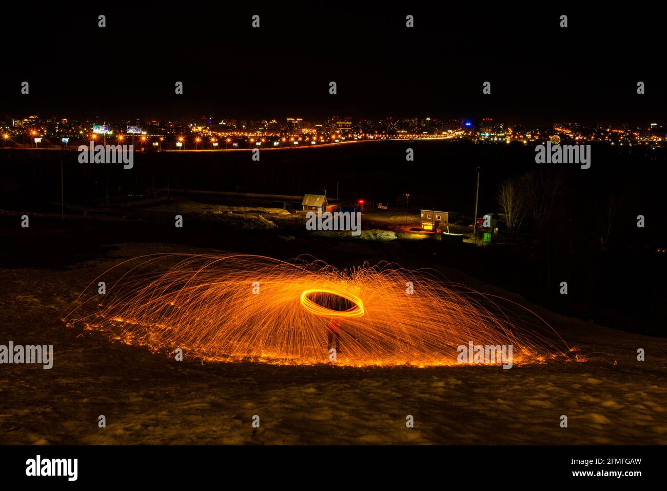 Large round burning fireworks sparkle from the burning steel wool. The ...
