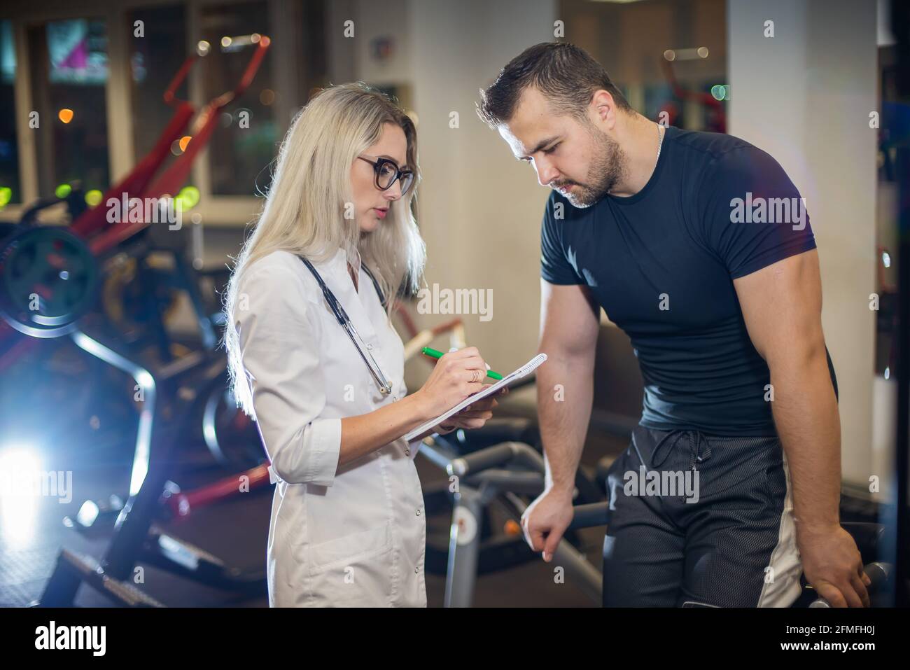 Medical examination. heart rate The doctor measures the pulse during a ...