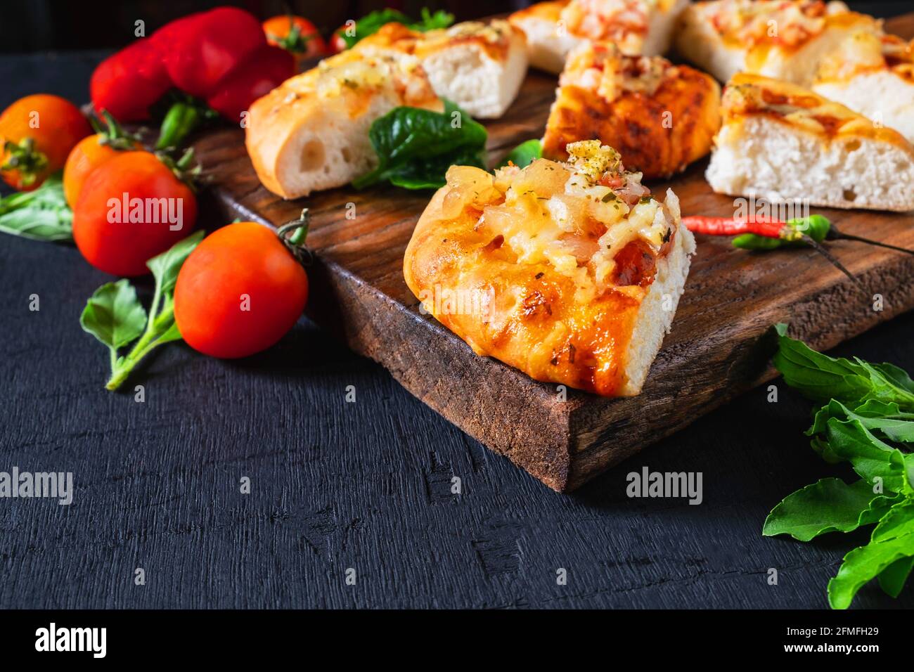 Hot pizza on wooden tray for pizza Stock Photo - Alamy