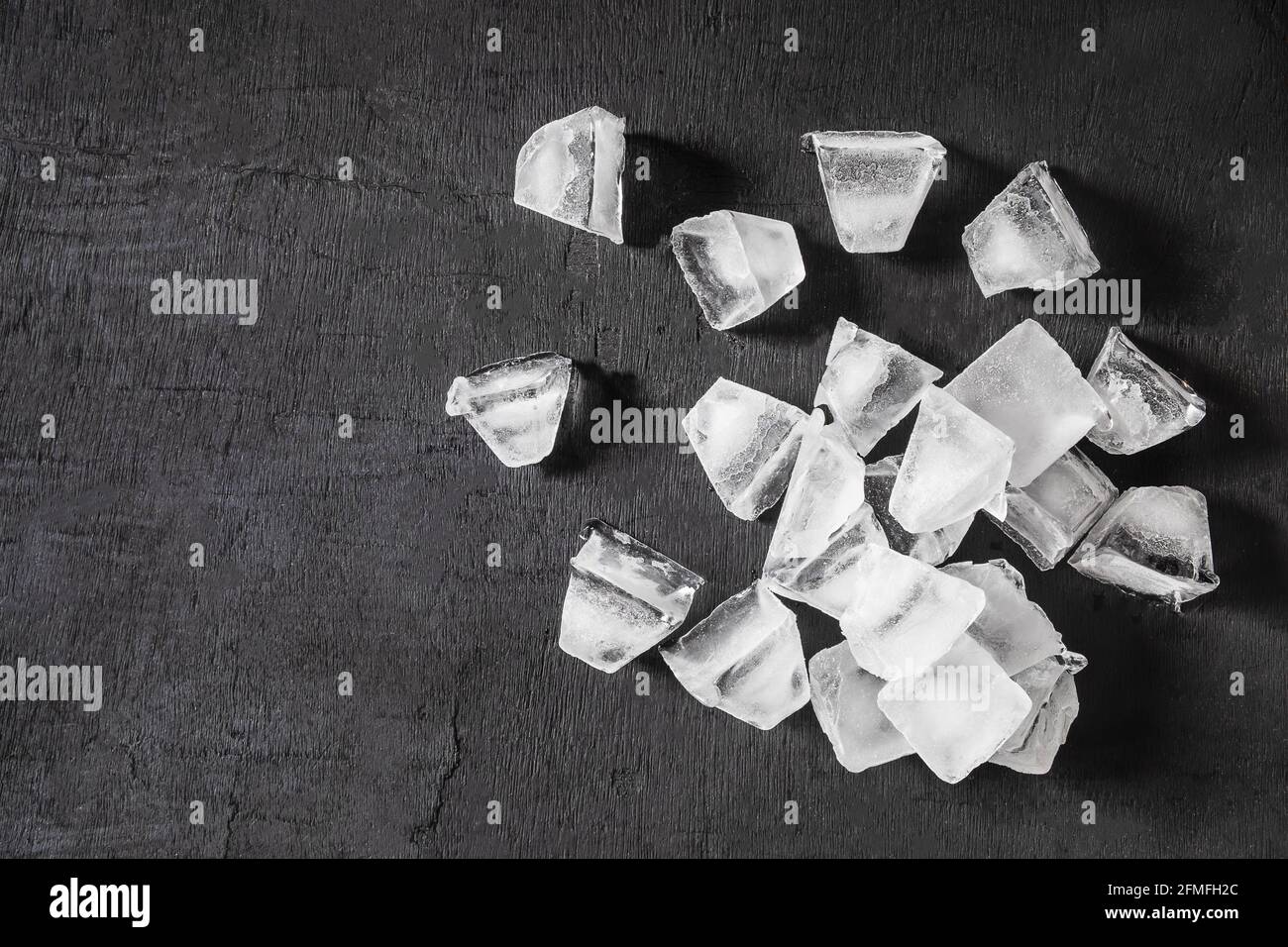 Ice cubes on a black background Stock Photo - Alamy