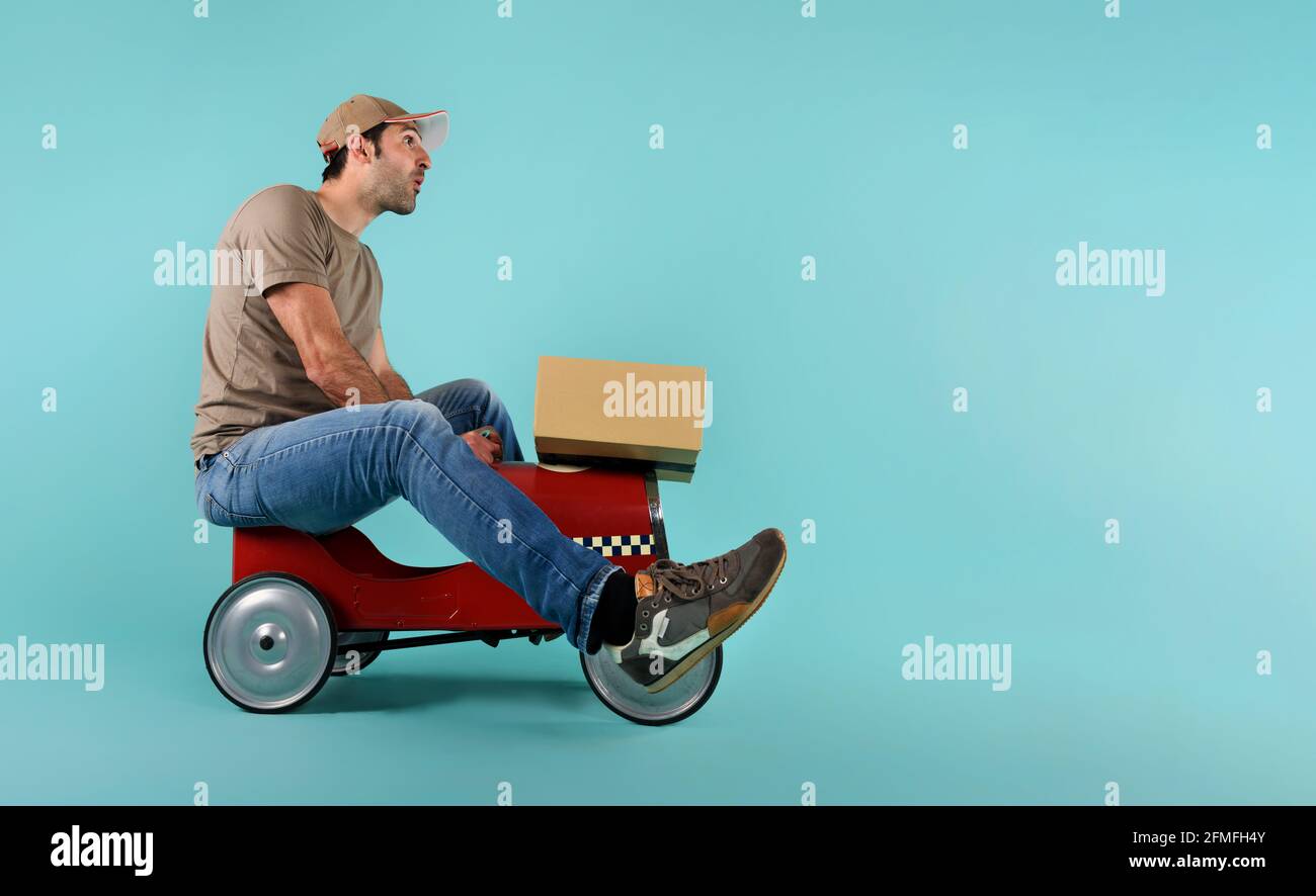 Courier drive fast with a toy car. Concept of fast and express delivery ...