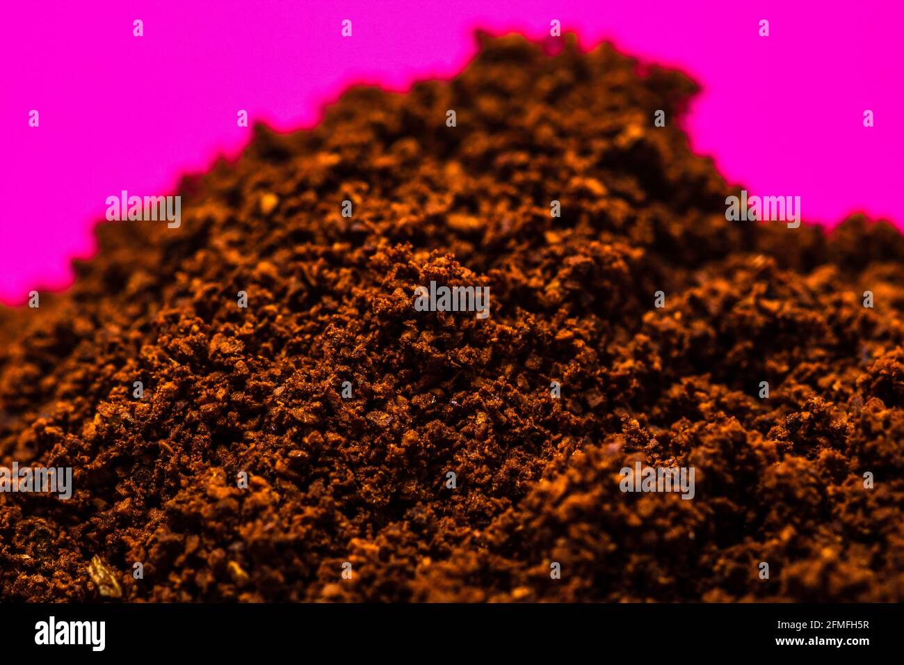 Close up photo of freshly ground coffee isolated Stock Photo - Alamy