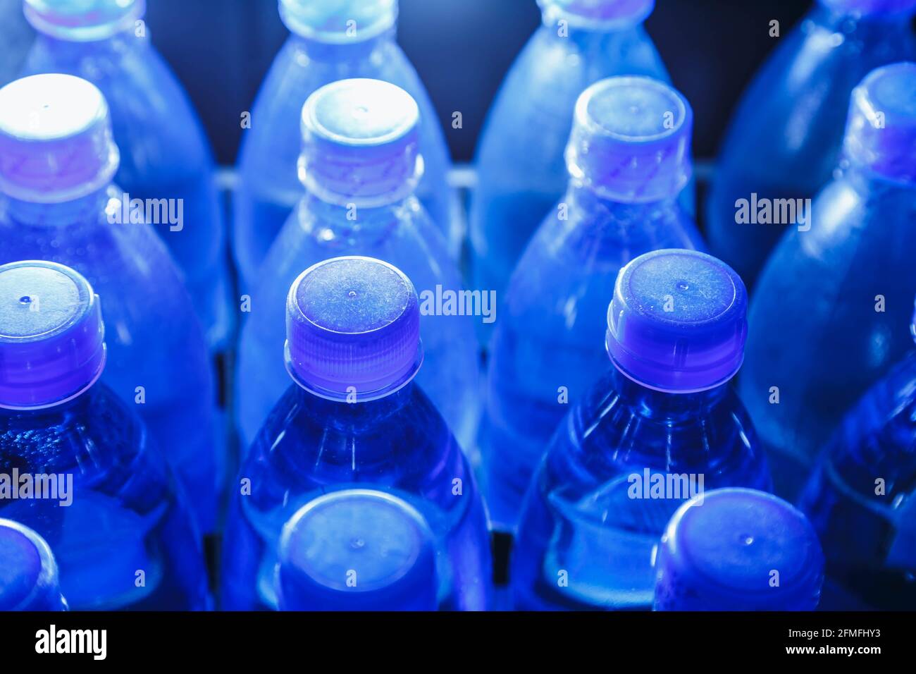 Bottles of drinking water in the water production plant Stock Photo - Alamy