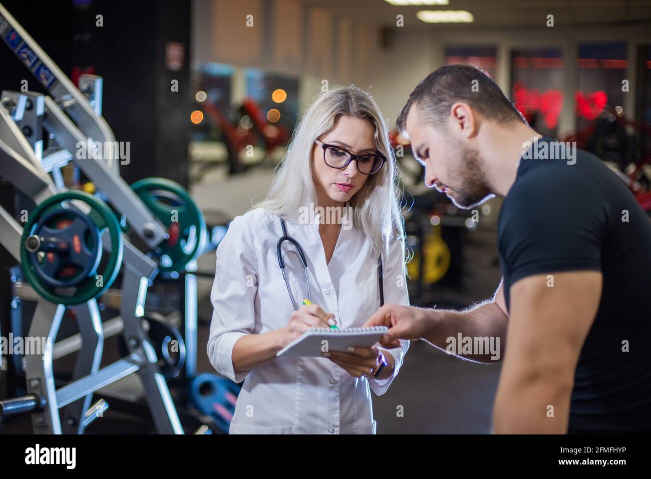 Medical examination. heart rate The doctor measures the pulse during a ...