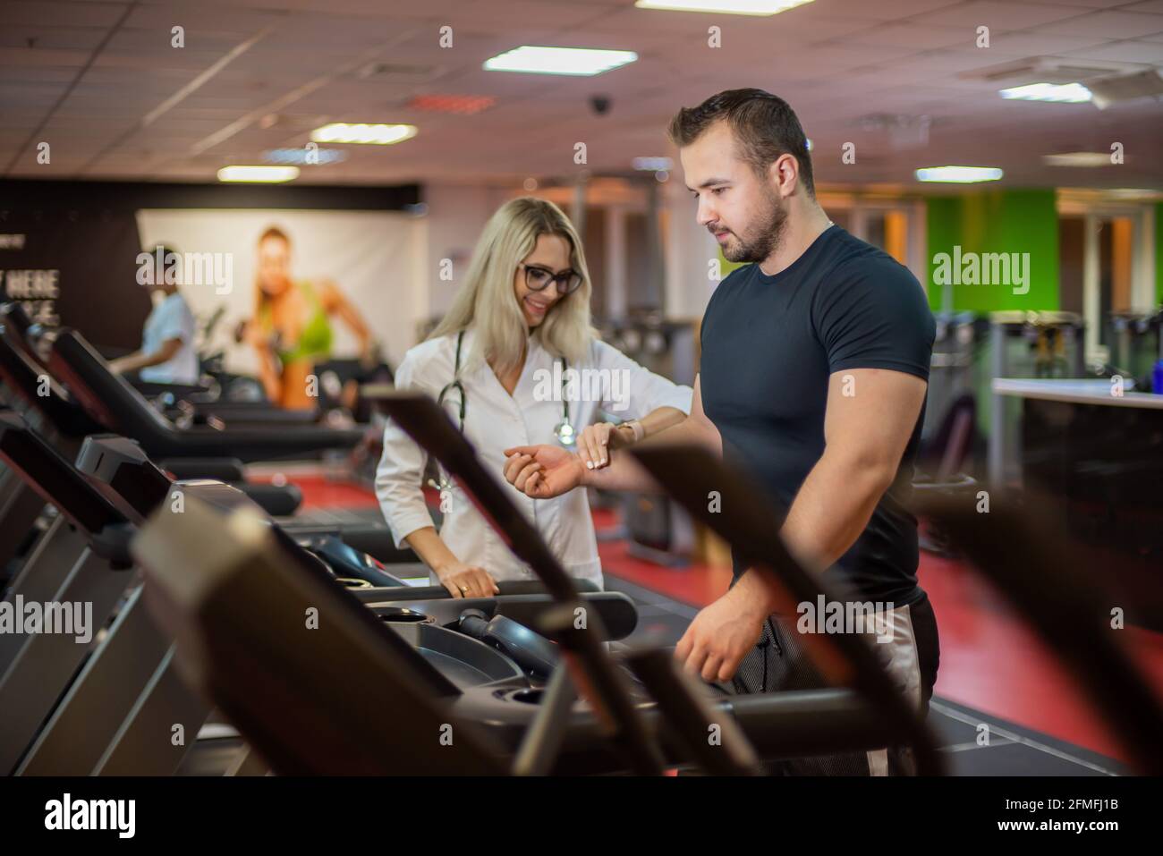 Medical examination. heart rate The doctor measures the pulse during a ...