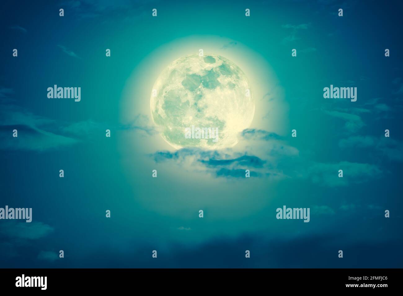 Attractive photo of a nighttime green sky with clouds and bright full ...