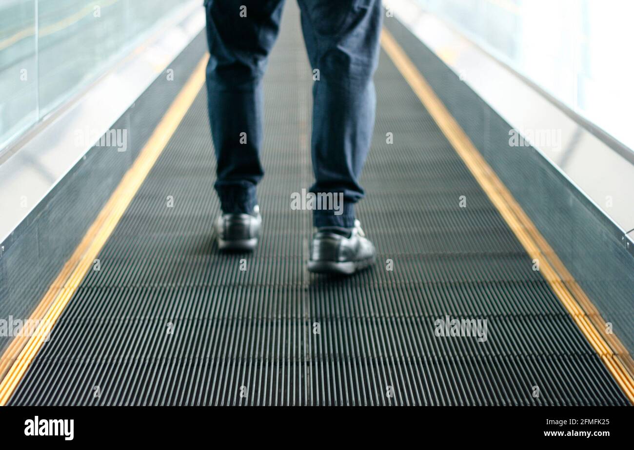 Pedestrian walking with zooming motion blur Stock Photo - Alamy