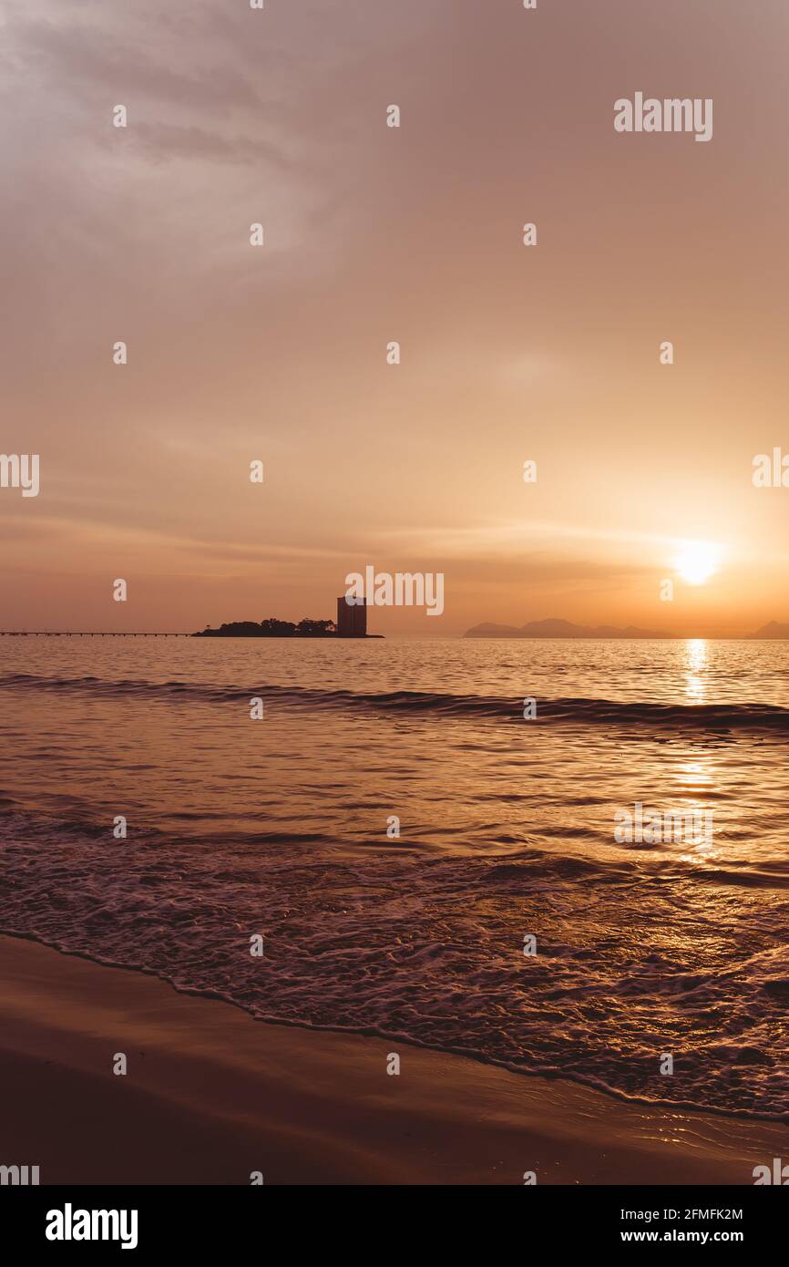 Pink toned sunset with a silhouette of the building Stock Photo - Alamy