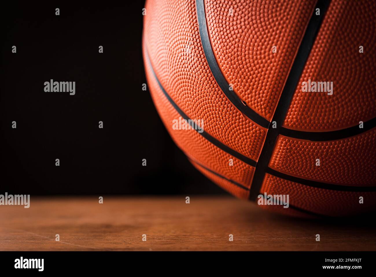 Basketball ball and dark empty space background Stock Photo - Alamy