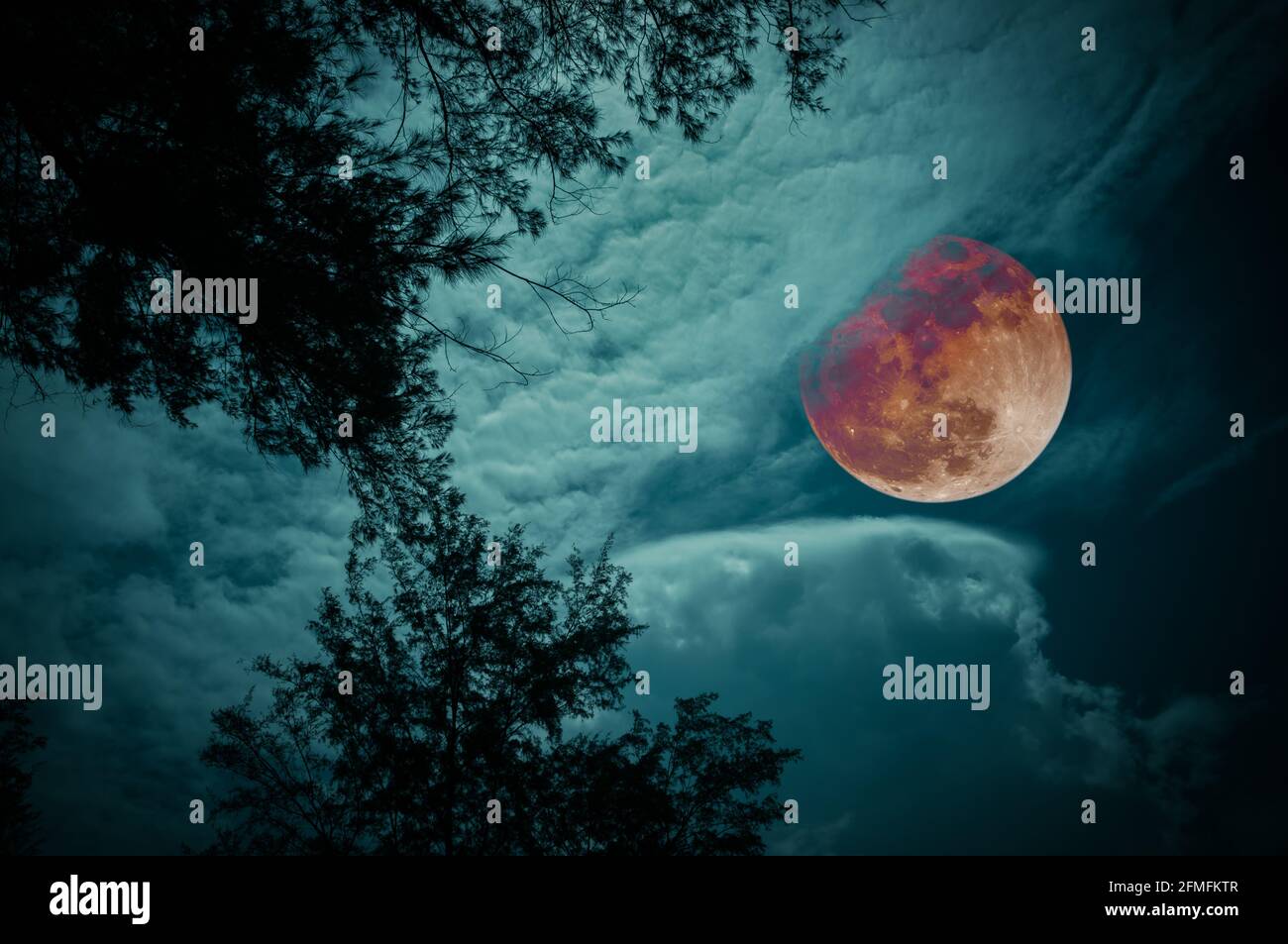 Attractive red super moon or blood moon on colorful sky above ...