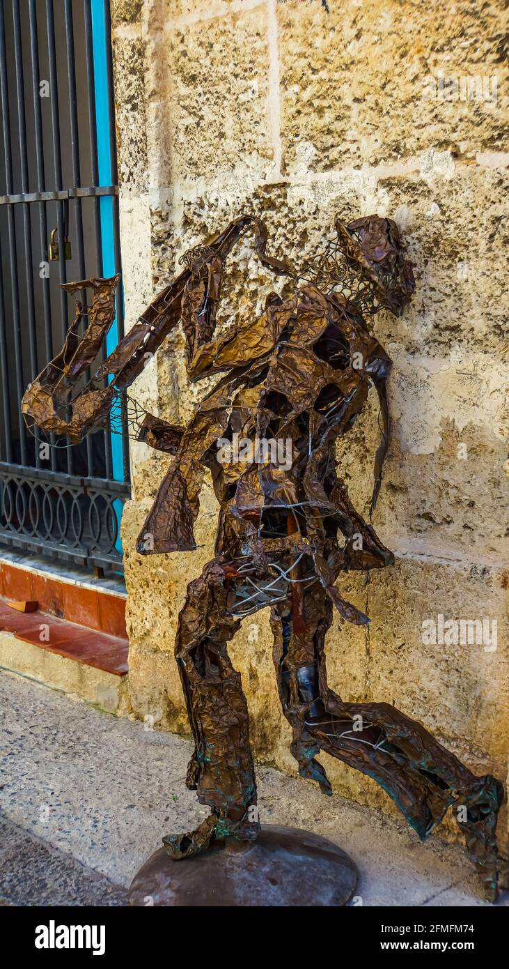 HAVANA, CUBA - JULY 1, 2017: Copper sculpture of man playing saxophone ...