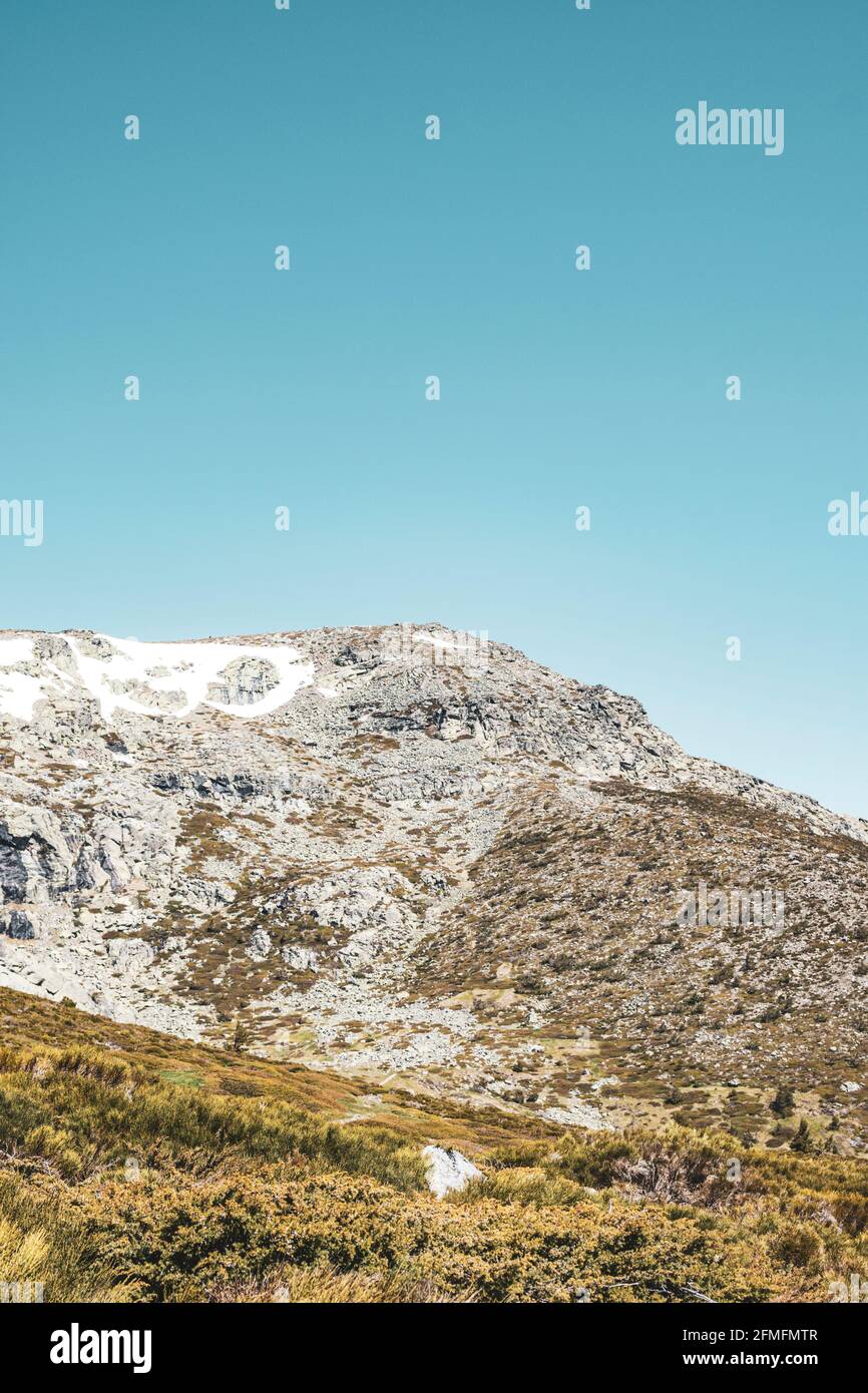 Mountain with a little snow and a completely clear blue sky Stock Photo ...