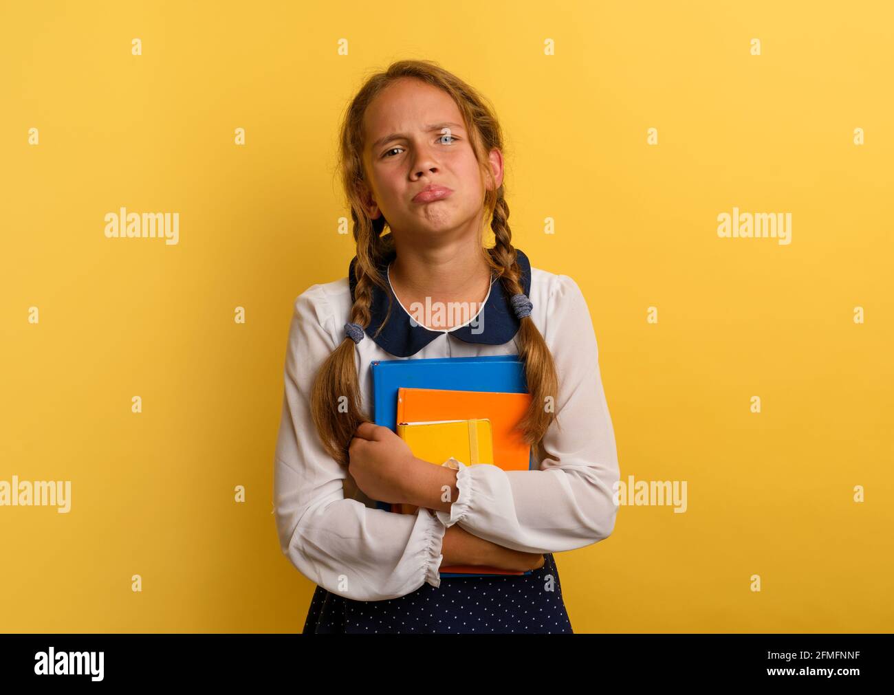 Girl cries because he has a lot of school homework. Emotional ...